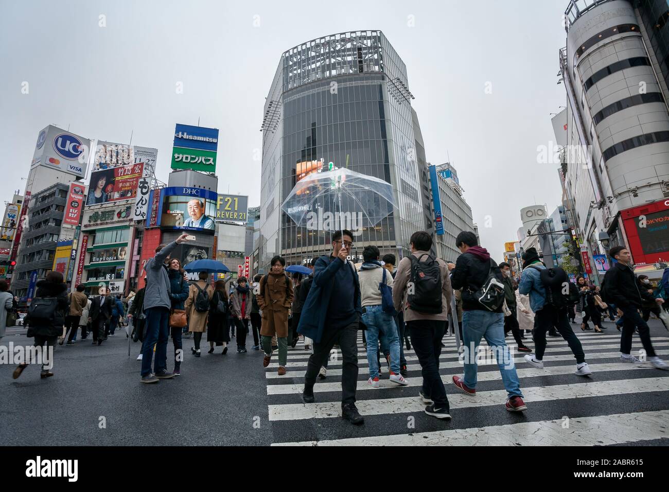 Japanese people and tourists cross the famous Shibuya Scramble crossing ...