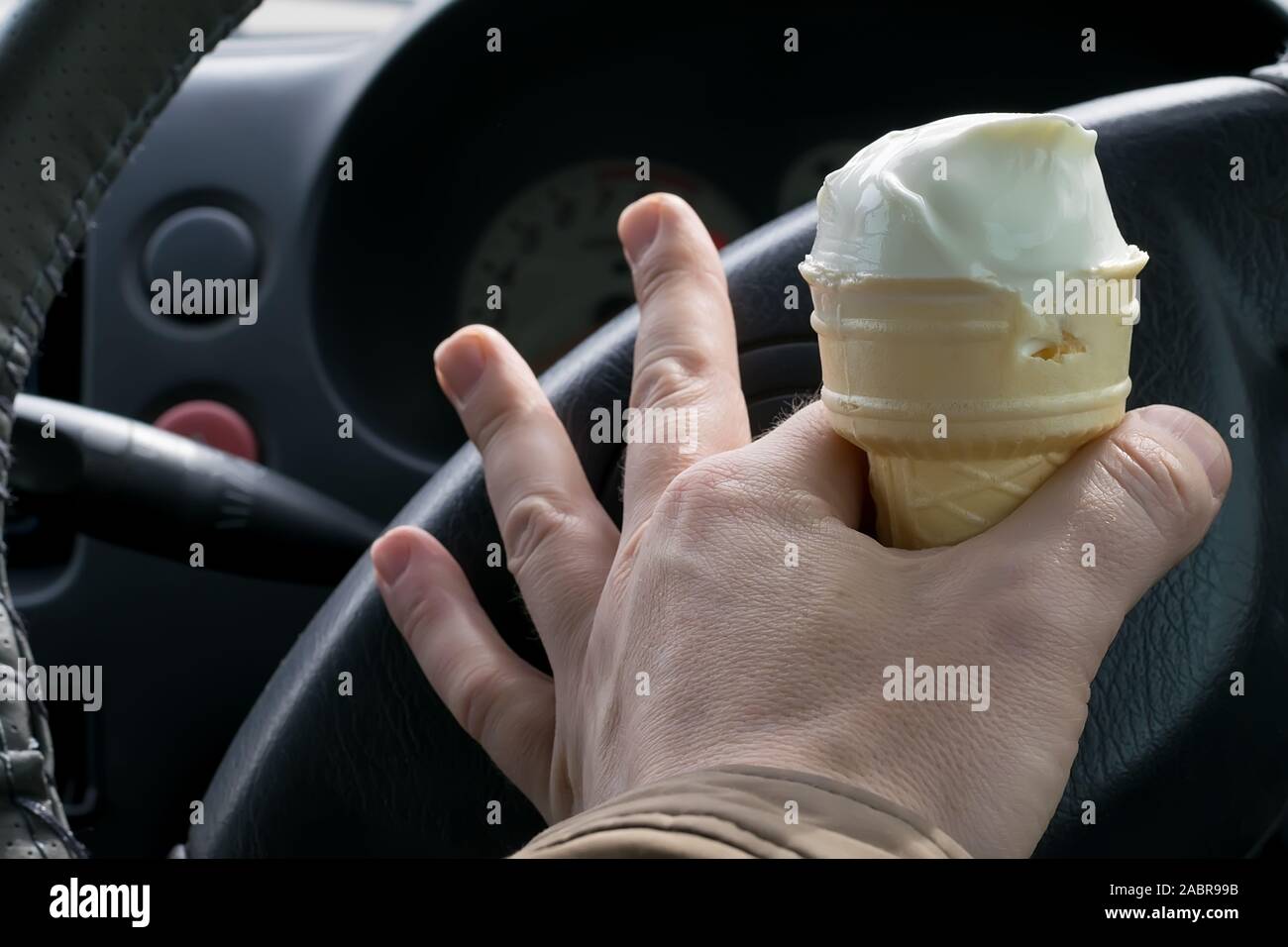 Eating food behind the wheel of a car hi-res stock photography and ...