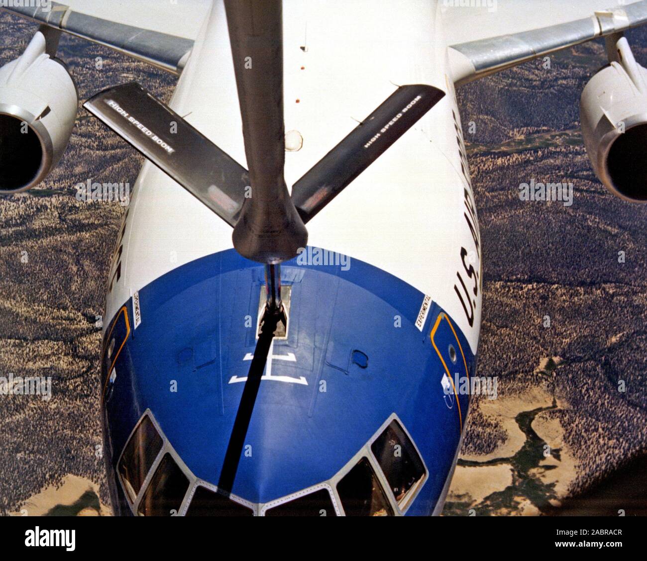 An air-to-air front view of a KC-10A Extender aircraft being refueled ...