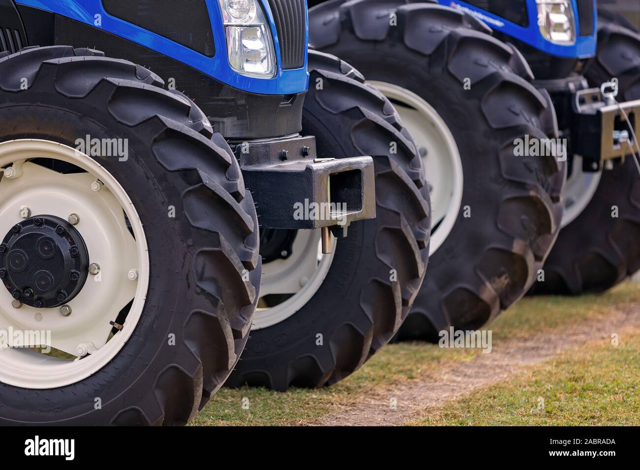 A row of tractors lined up on display at a country agricultural show ...