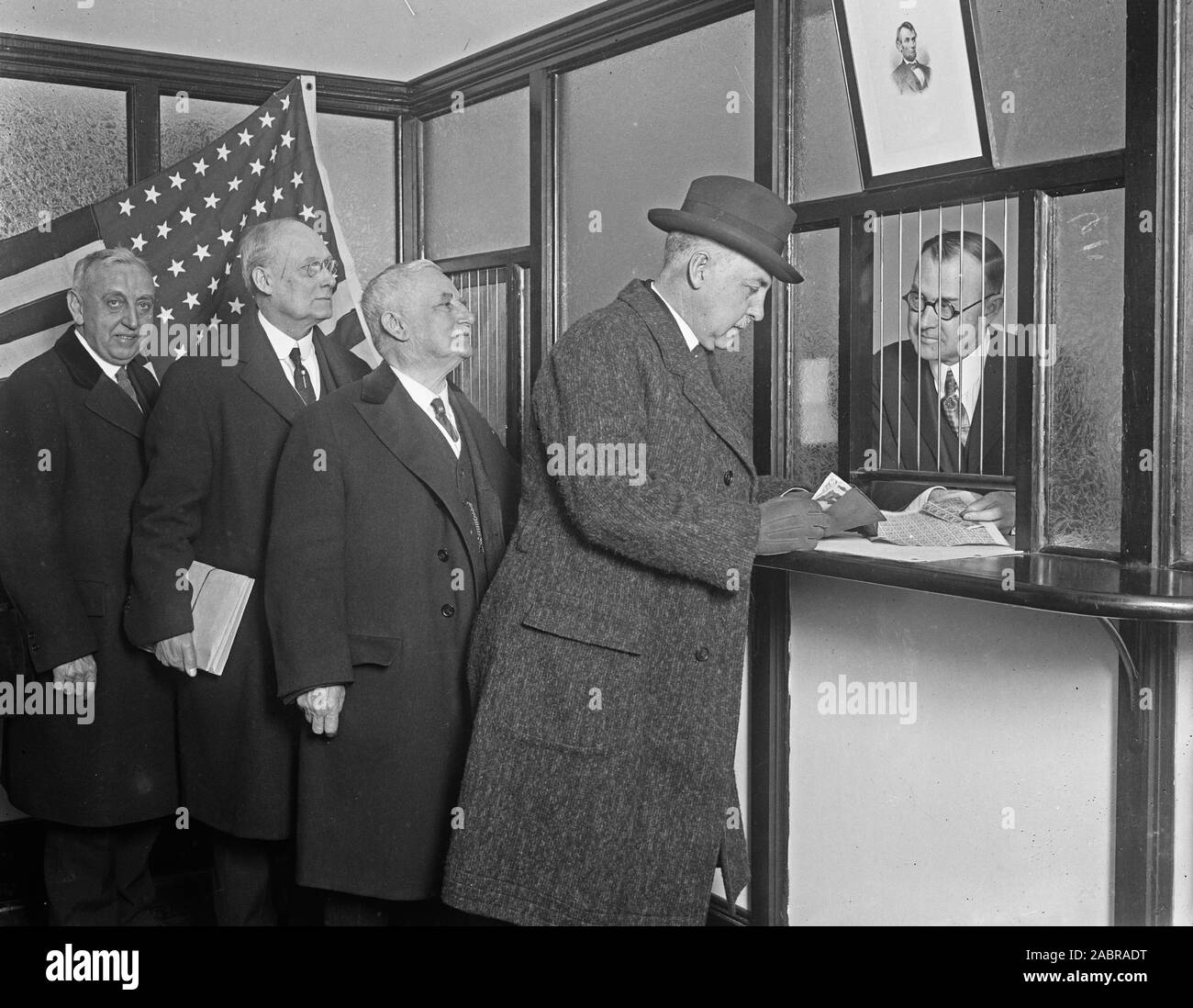 Men standing in line at a post office window ca. 1923 Stock Photo - Alamy