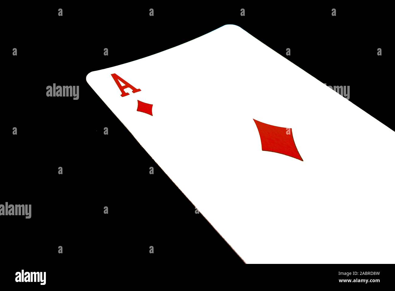 Red Ace of Diamonds on black background Stock Photo - Alamy