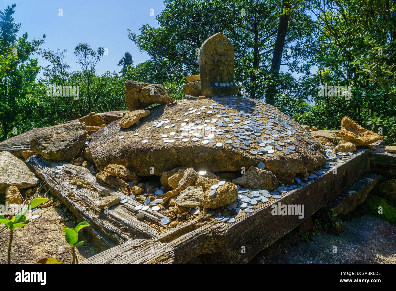 Miyajima, Japan - October 13, 2019: Buddhist coin offering on the top ...