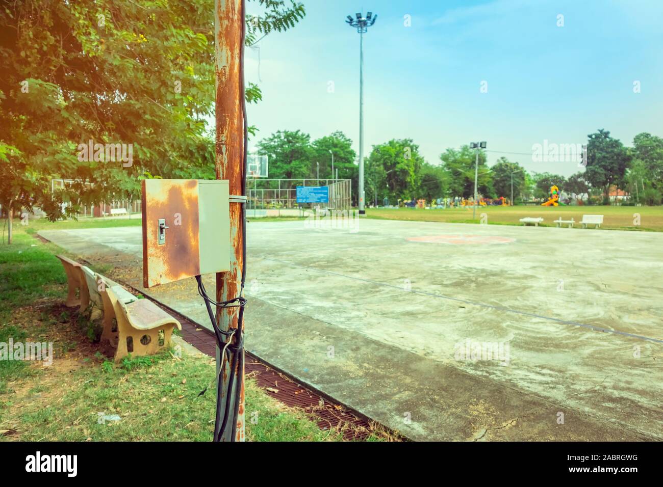 Old rusty electrical power control box on rusted electric pole in the ...