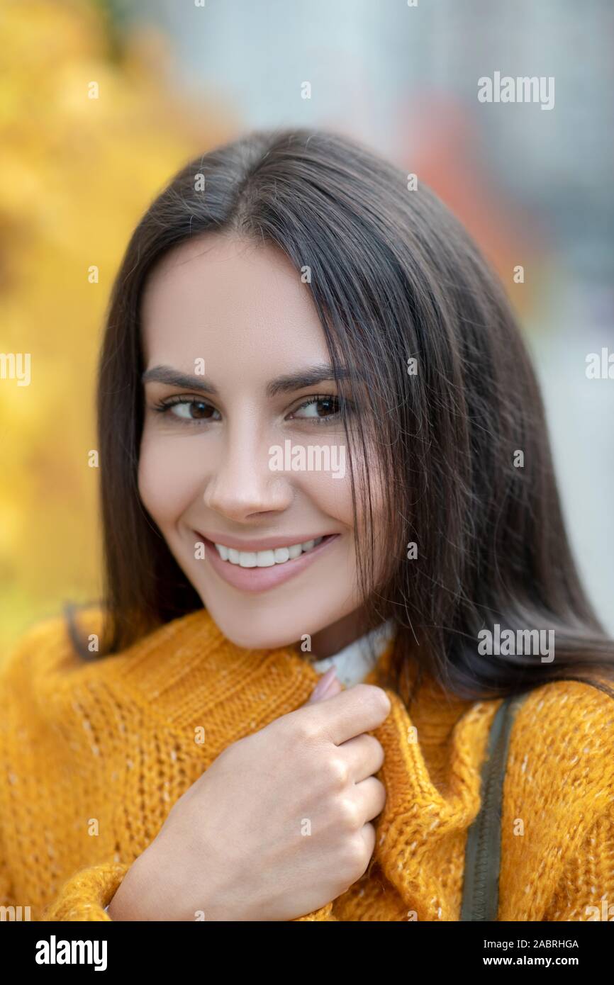 Sincere emotions. Beautiful face of a happy young woman while showing ...