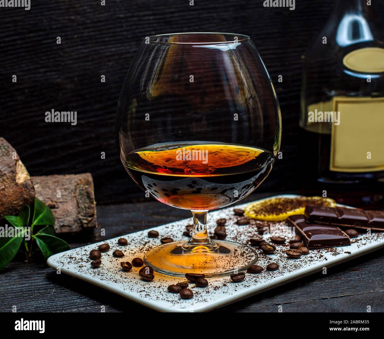 glass of cognac and chocolate bars Stock Photo - Alamy