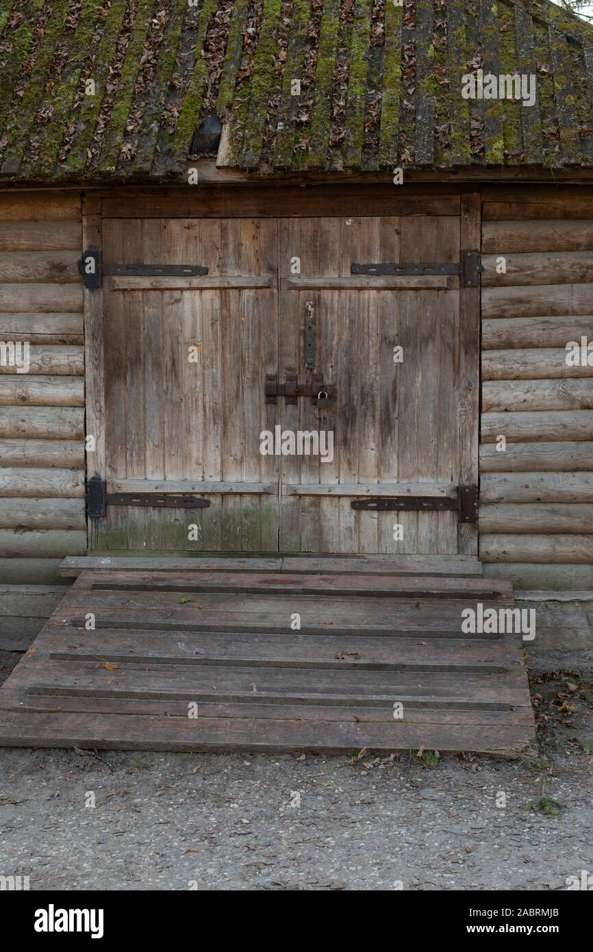 Old raw wooden barn gate, rural building for cattle, stable, warehouse ...