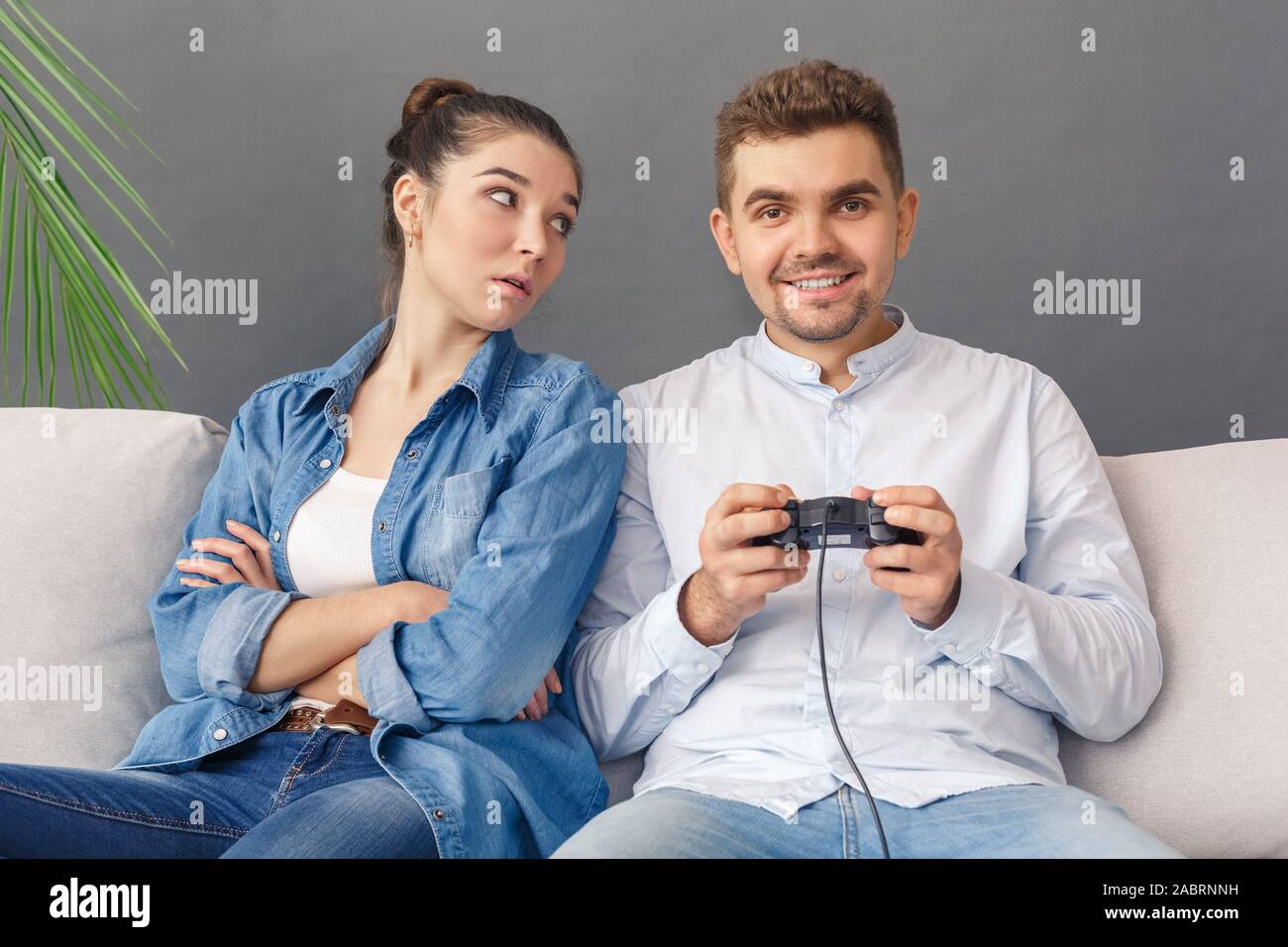 Young couple man smiling excited holding controller playing video game ...