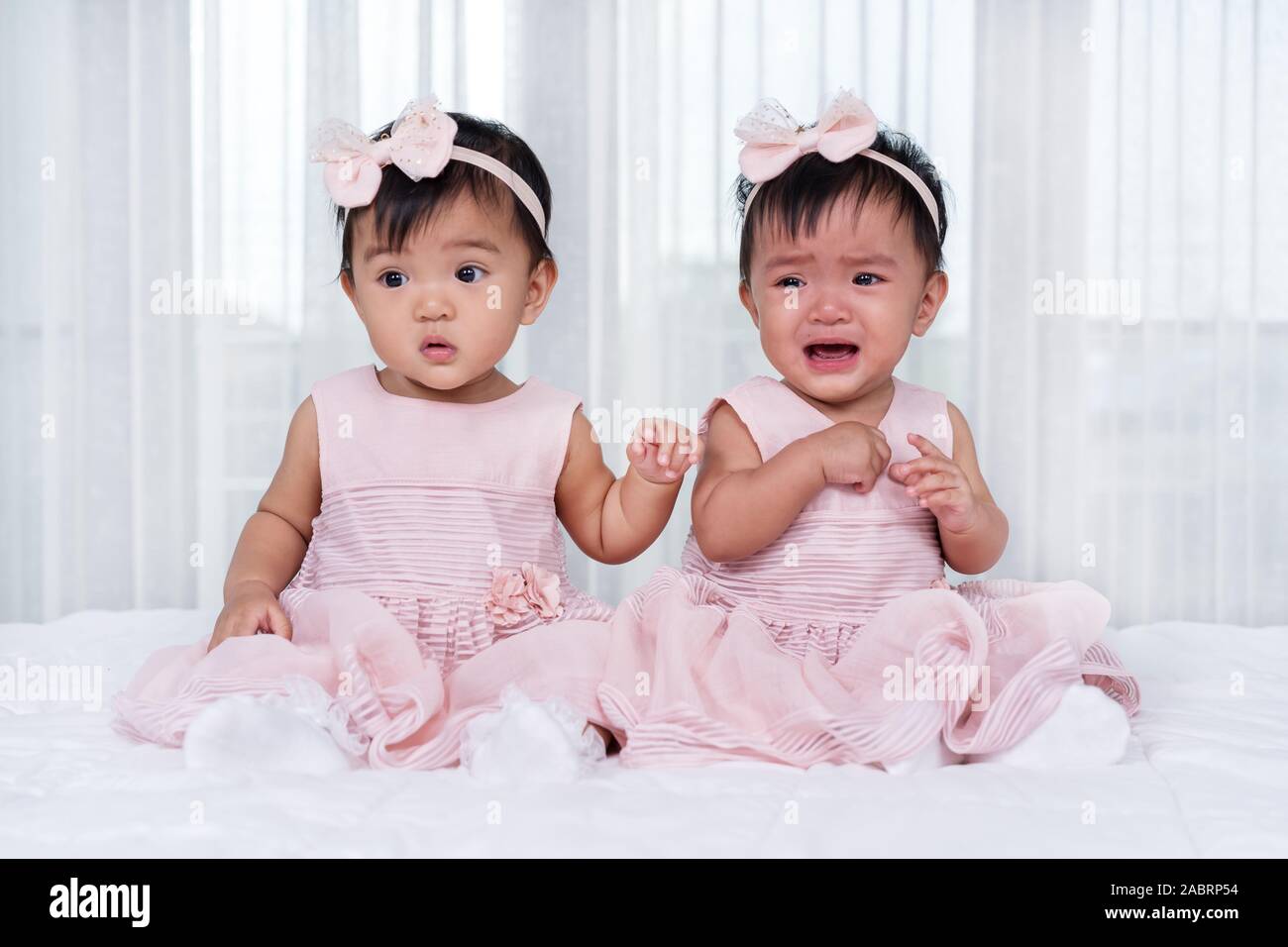 Twins, boy girl, sad hi-res stock photography and images - Alamy