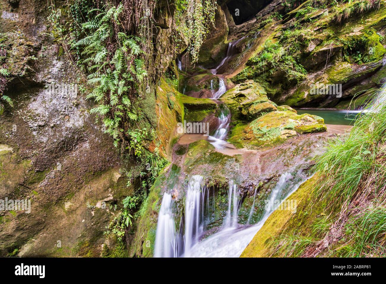 Caglieron caves and waterfalls. Emerald colored magic Stock Photo - Alamy