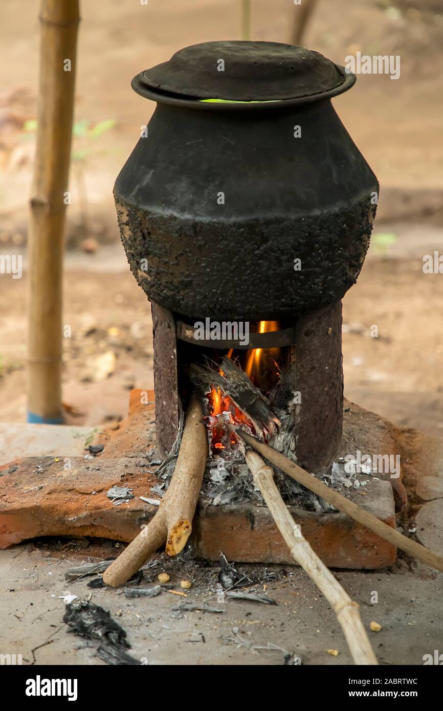 Old cooking pot stove using firewood.Large metal cauldron over a fire ...