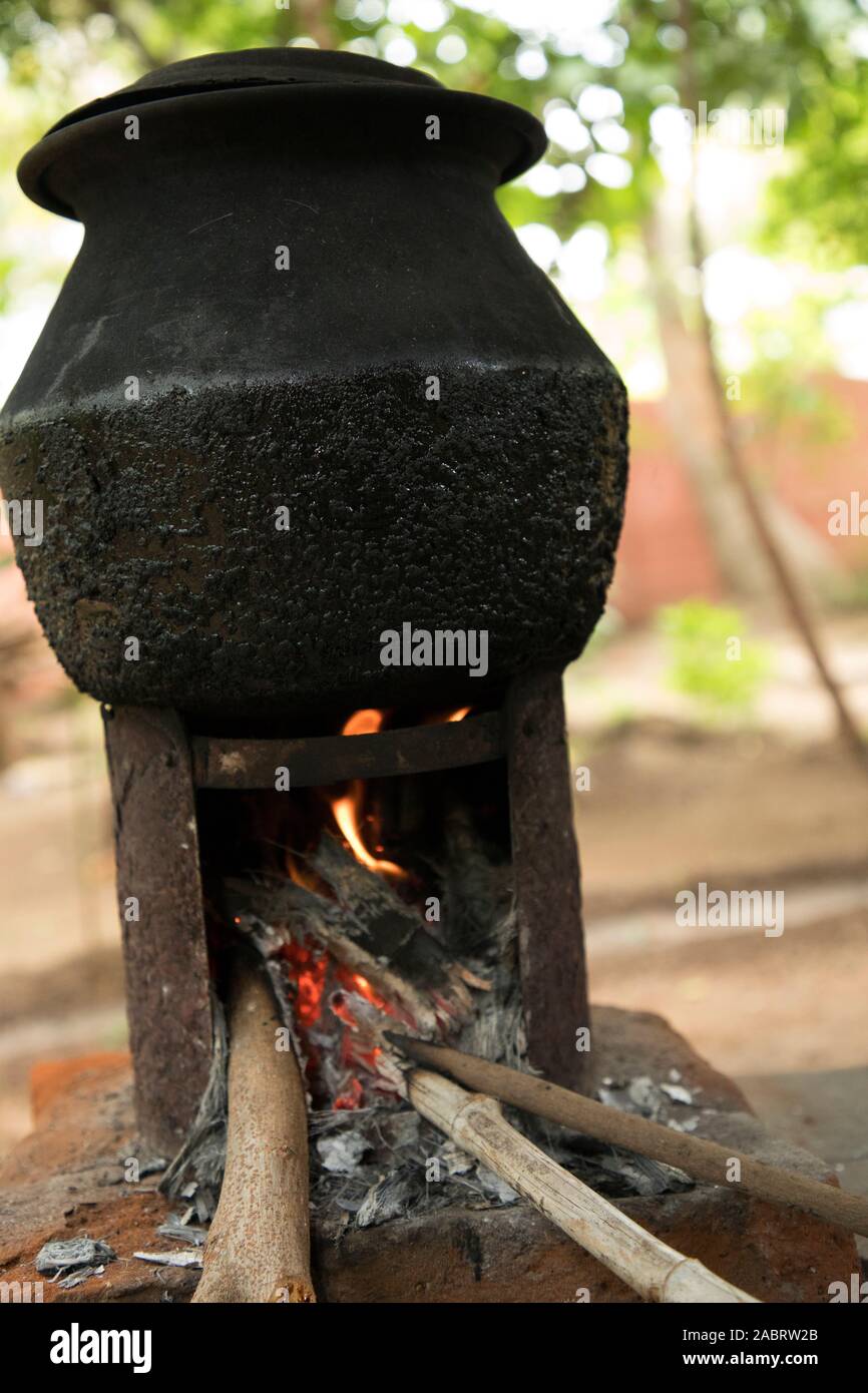 Heating a large pot of water in rural India Stock Photo - Alamy