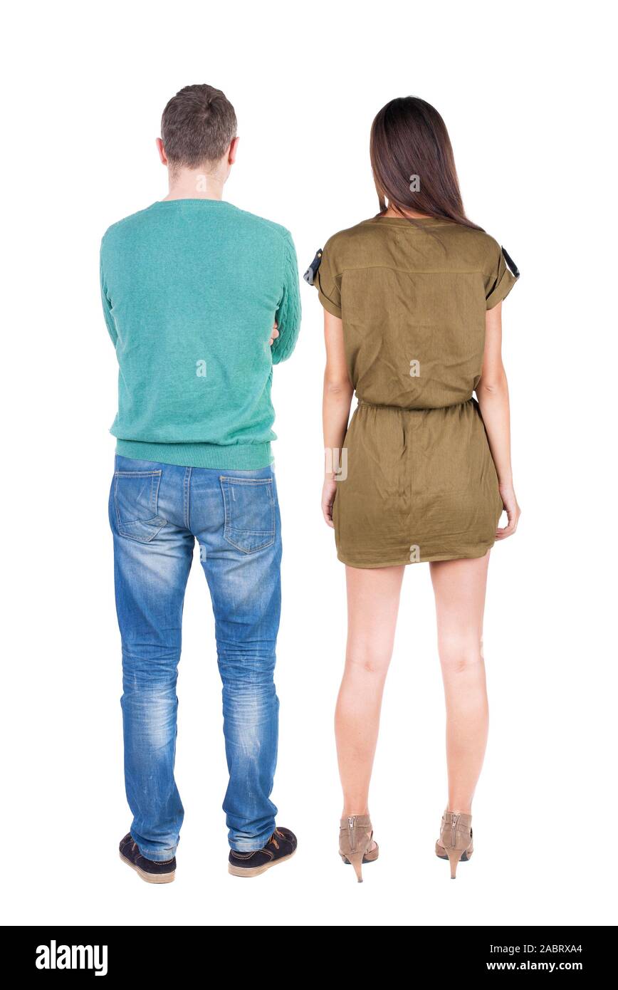 Back view of couple. beautiful friendly girl and guy together. Rear ...