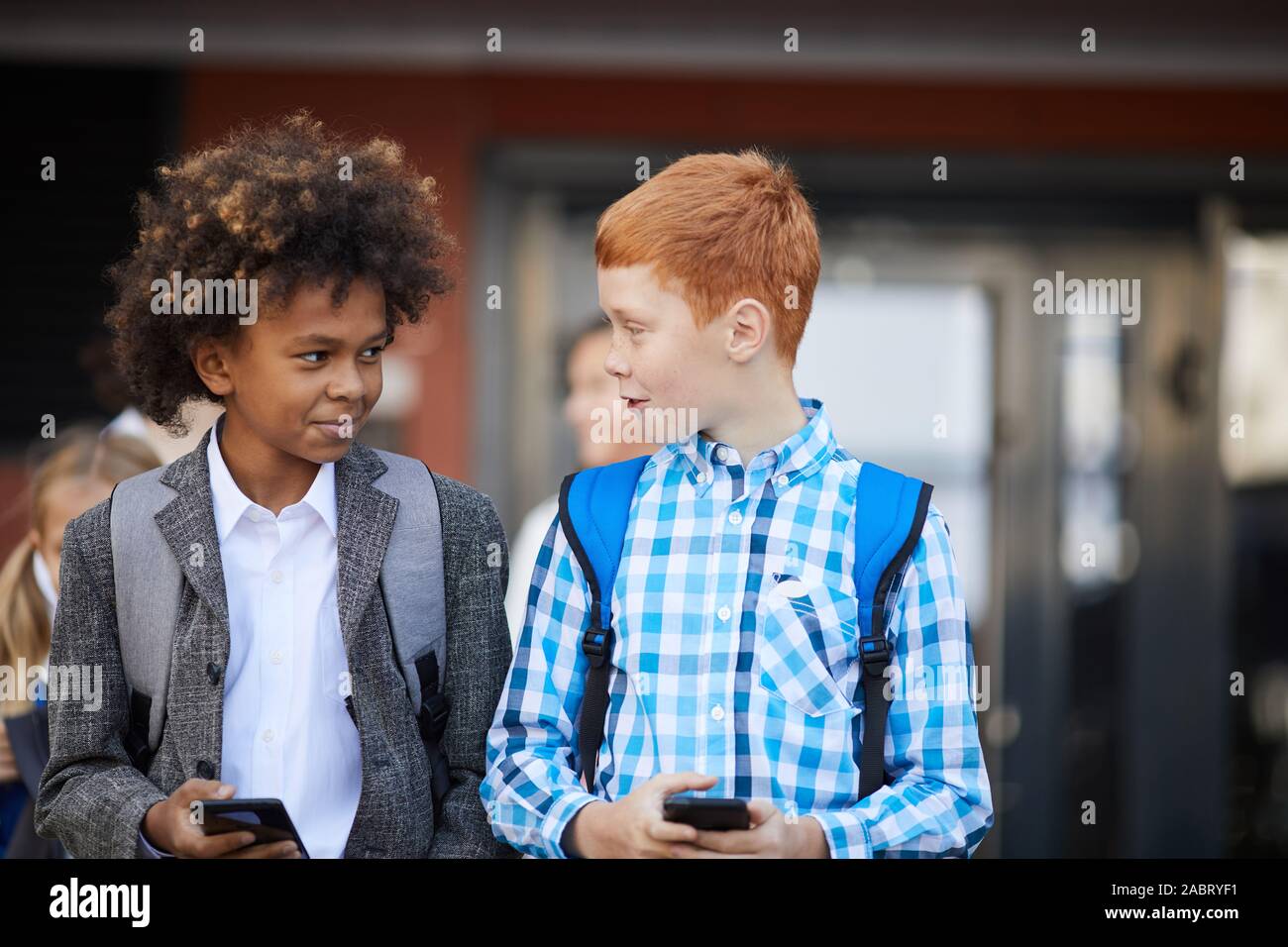 Two boys talking hi-res stock photography and images - Alamy