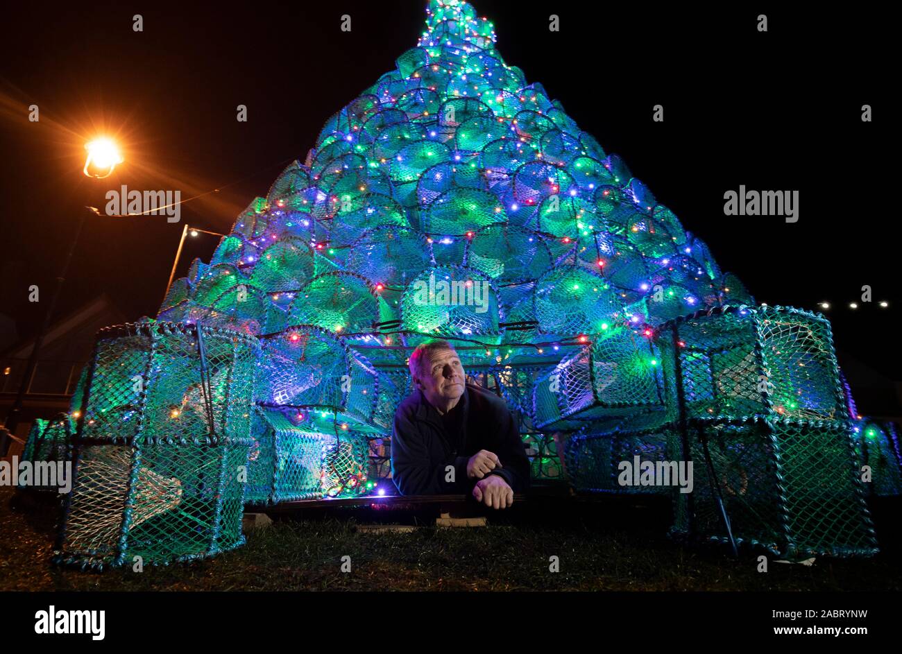 Gordon wink lies underneath 16ft christmas tree hi-res stock ...