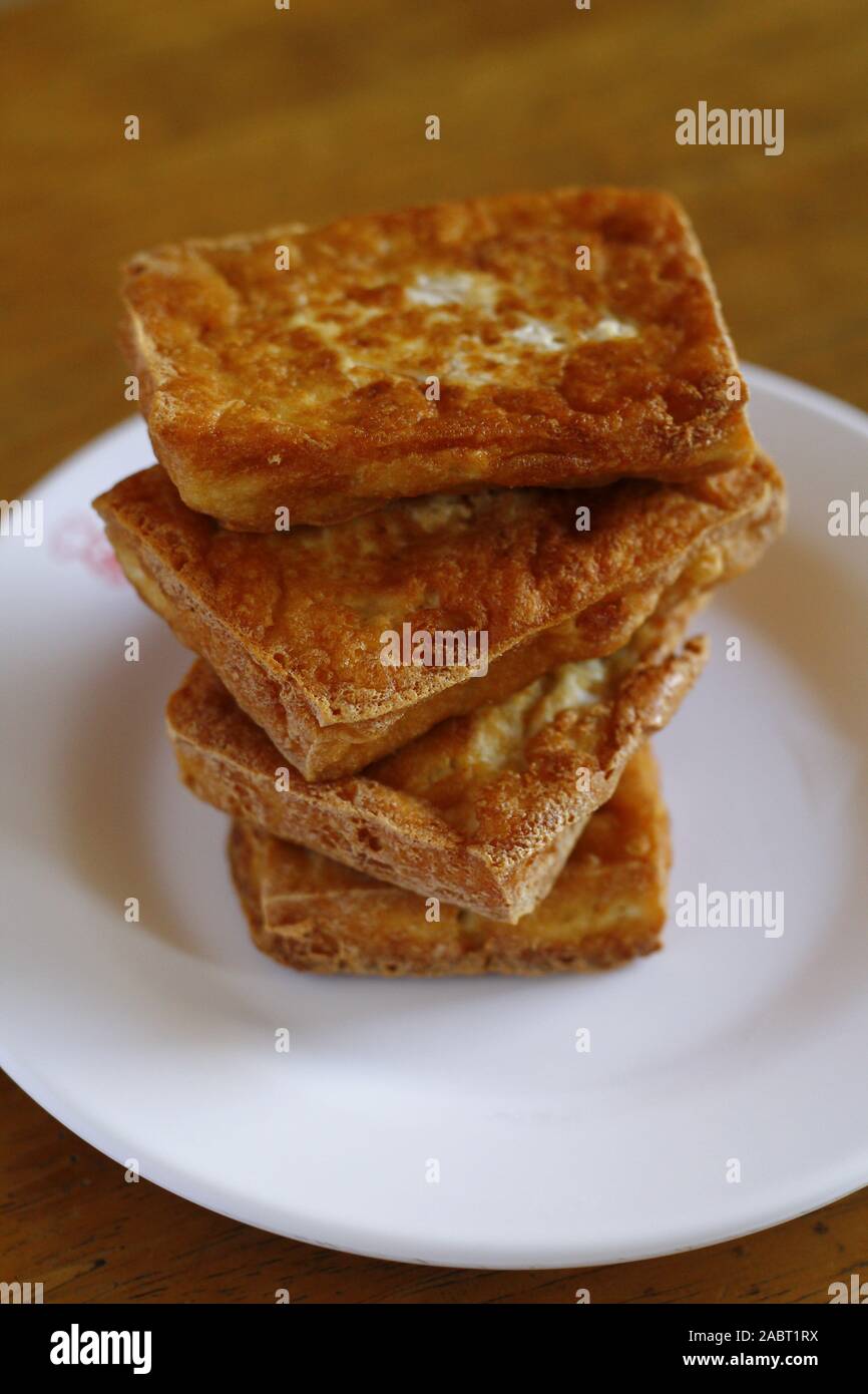 Photo of a stack of freshly fried tokwa or tofu or soy bean curd Stock ...