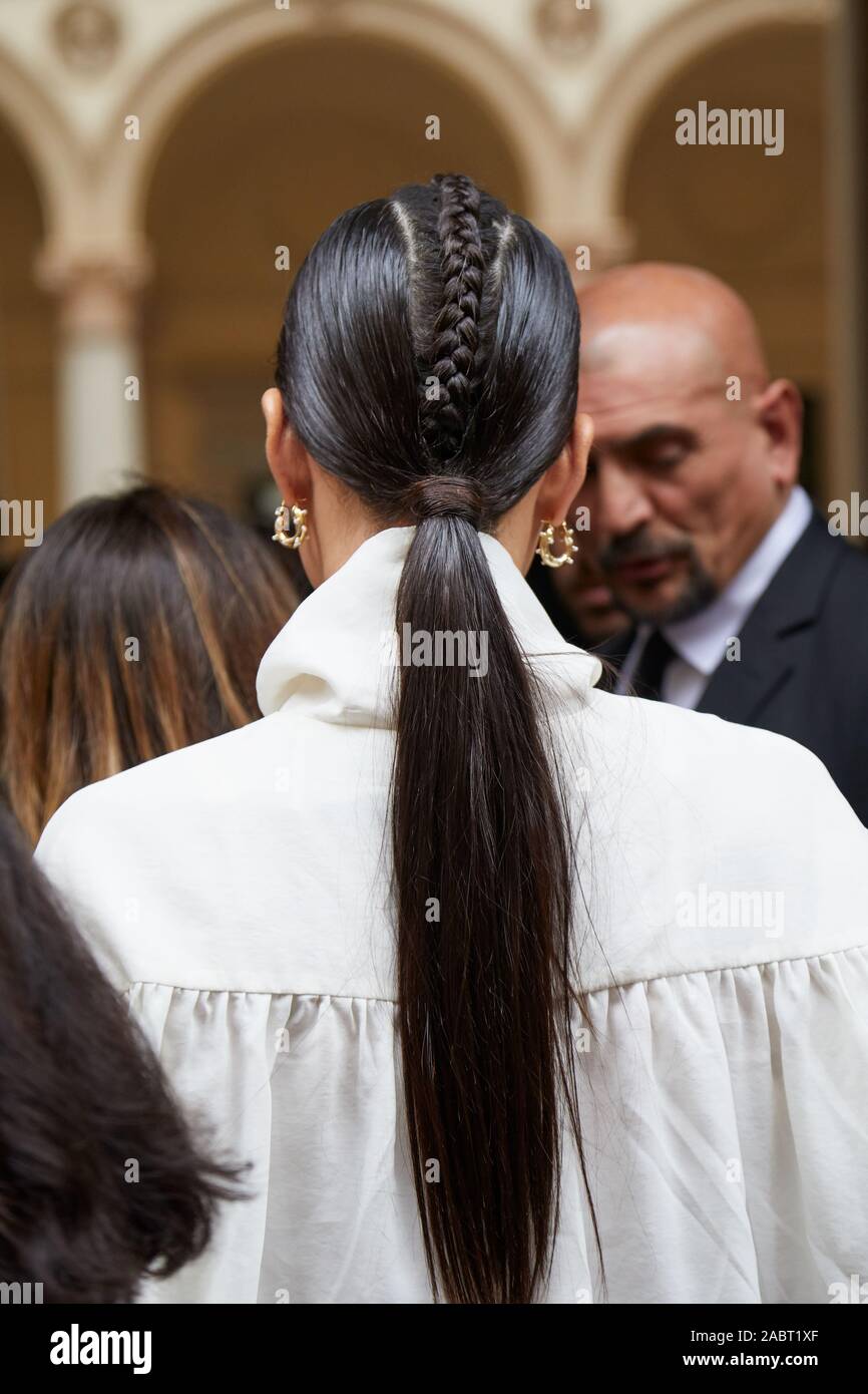 MILAN, ITALY - SEPTEMBER 18, 2019: Woman with braid and white shirt ...
