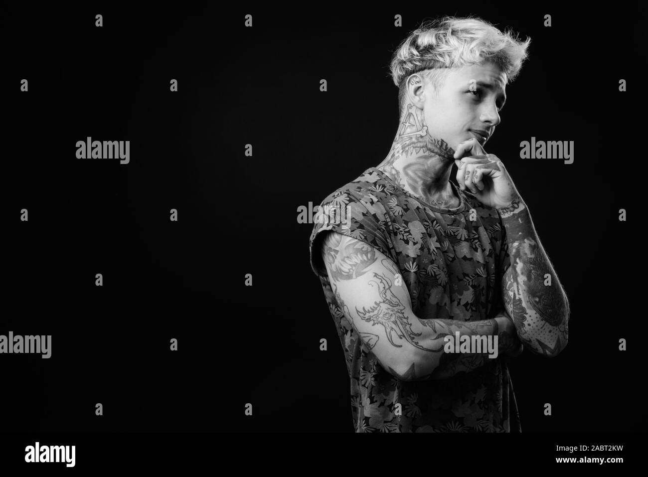 Young handsome rebellious man with blond hair in black and white Stock ...