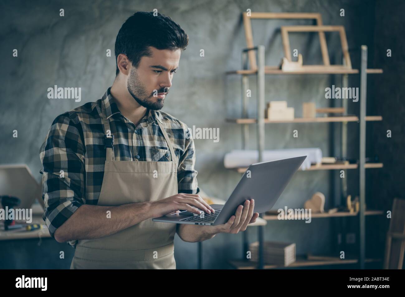 Photo of handsome guy holding notebook watching online video ...