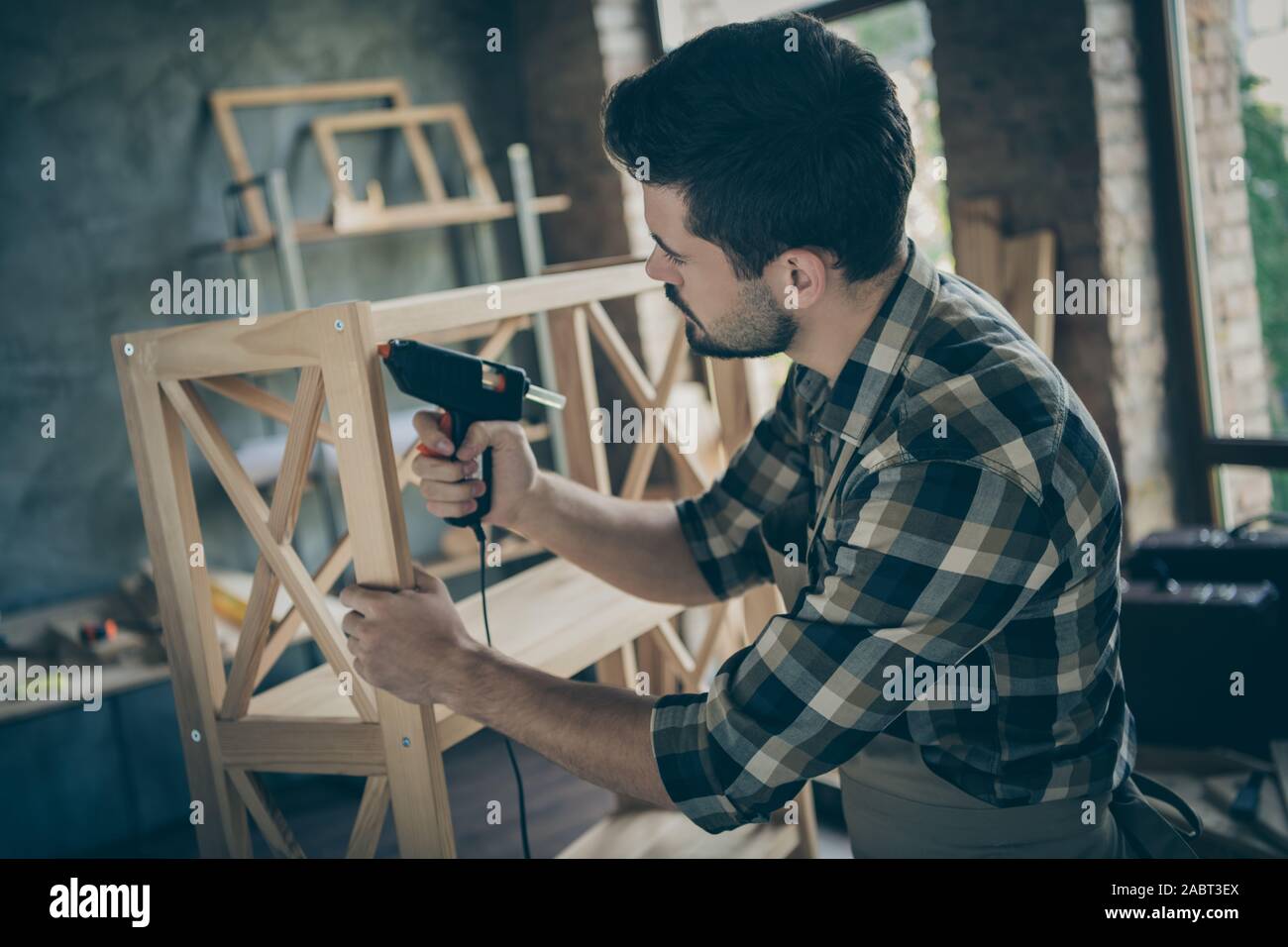 Profile photo of handsome guy building book shelf handmade design ...