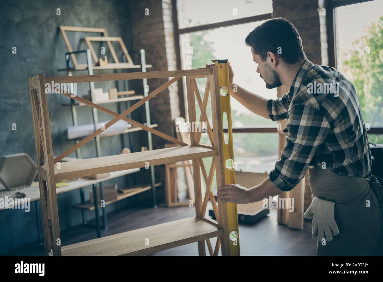 Profile photo of handsome guy building book shelf handmade design ...