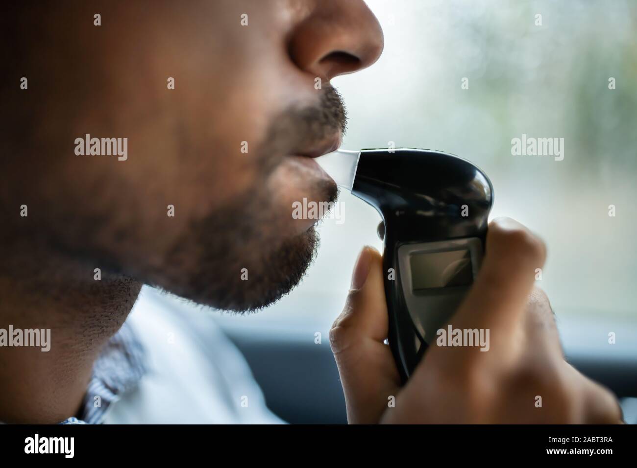 Man Sitting Inside Car Taking Alcohol Test Stock Photo - Alamy