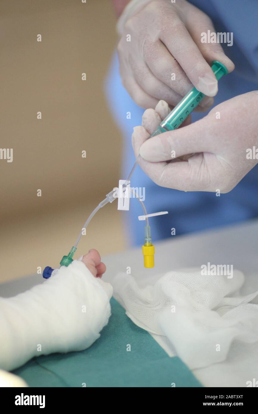 Doctor perform medical manipulations for the treatment of a small child ...