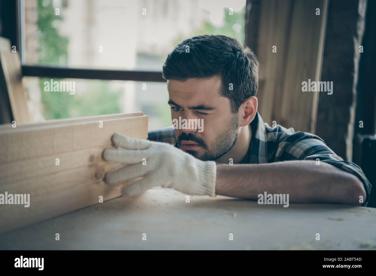 Close up photo of focused confident serious man measuring distance ...