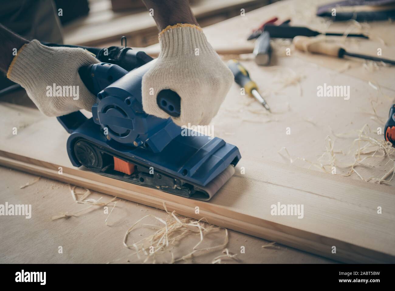 Close up cropped photo of sander used to process wooden materials and ...
