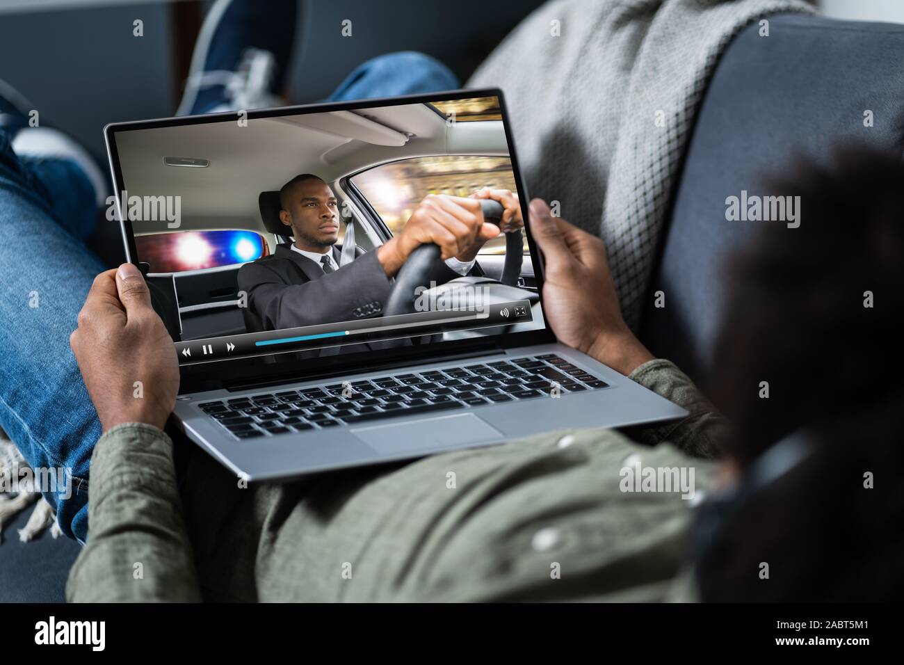 Close-up Of A Man Watching Thriller Movie On Laptop Stock Photo - Alamy
