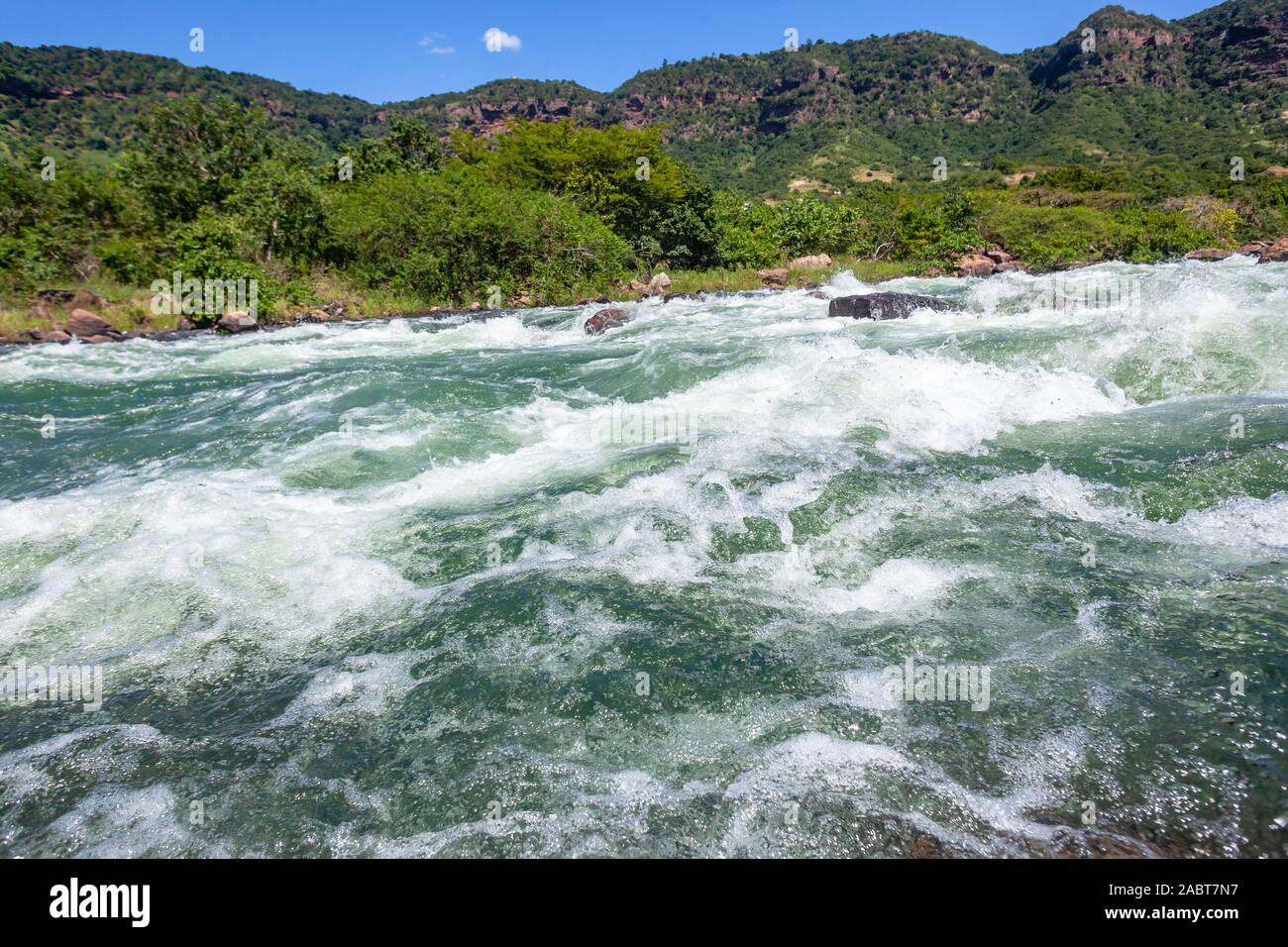 River water rapids rocks raging currents natures power closeup valley ...