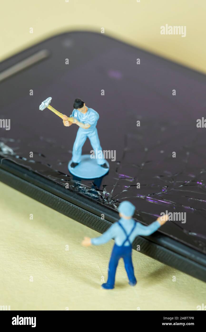 Repairman examining broken screen hi-res stock photography and images ...