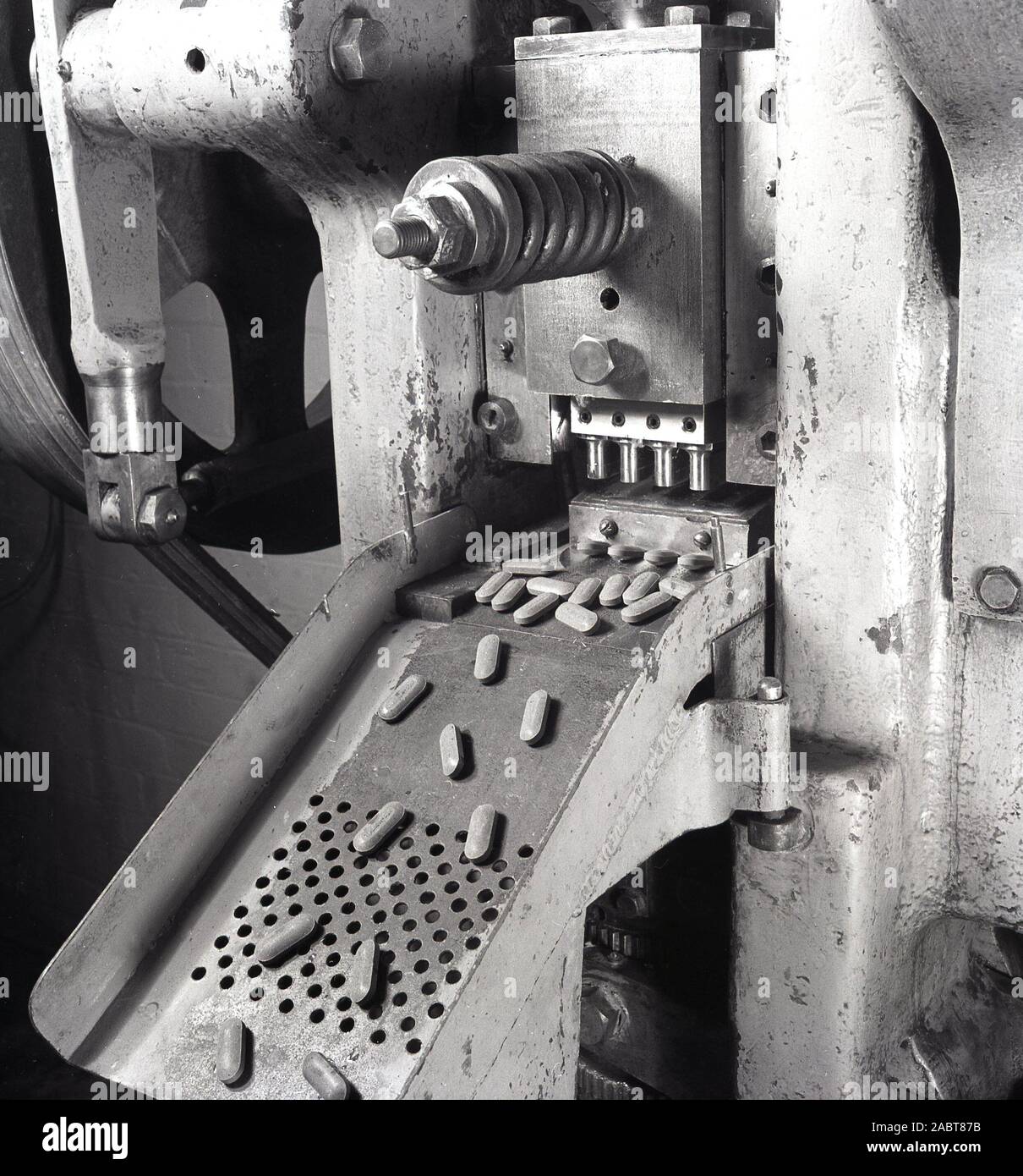 1950s, historcai, medical tablets or pills being made by a metal ...