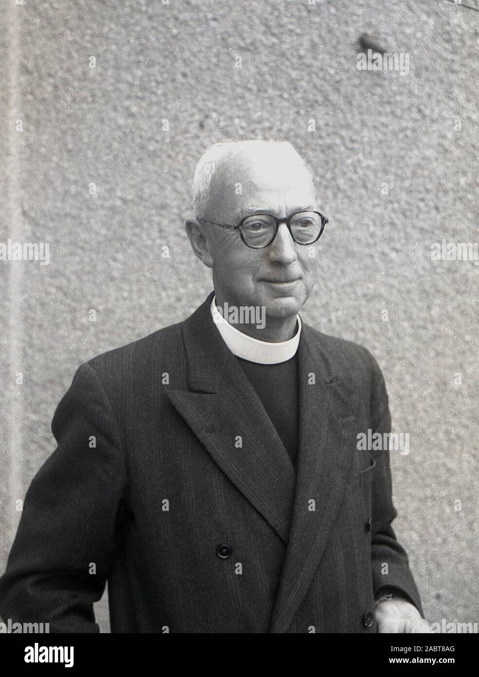 1950s, historical, portrait of an elderly parish vicar, standing ...