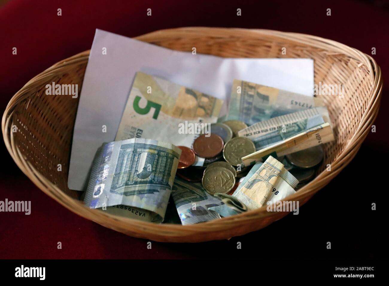 Catholic mass. Basket with alm collection. Passy. France Stock Photo ...