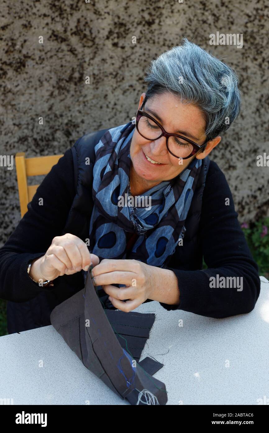 Zen sesshin (retreat) in Tamie, France. Devotee sewing a kesa Stock ...