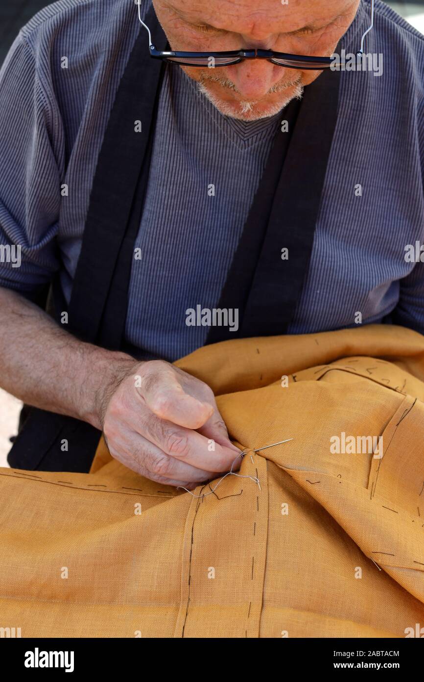 Zen sesshin (retreat) in Tamie, France. Devotee sewing a kesa Stock ...