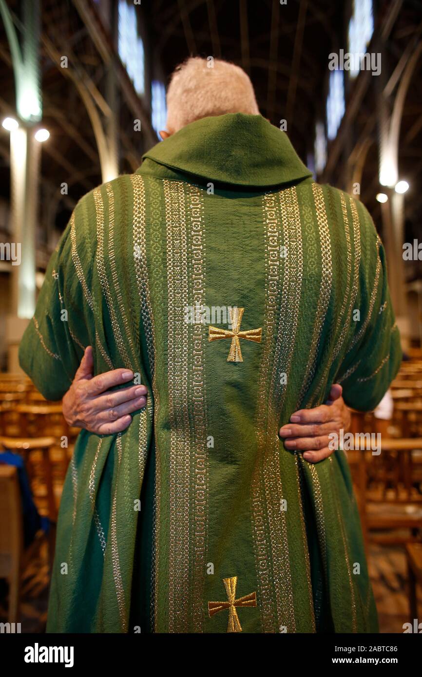 Catholic priest hugged by his parishioners after his last mass at Notre ...