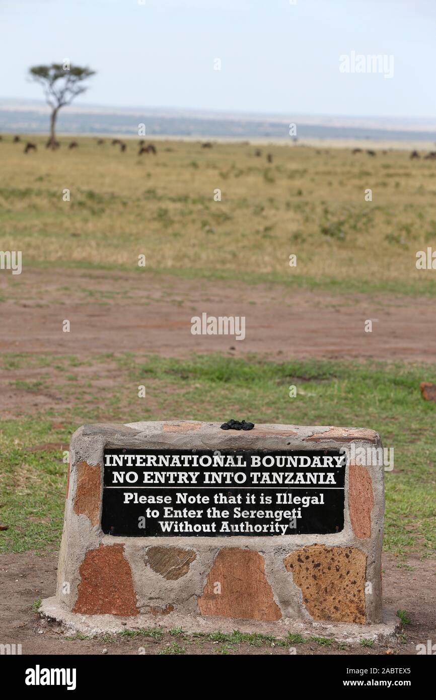 Road sign indicating the Kenya and Tanzania border. Masai Mara National ...