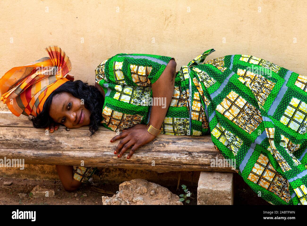 African woman lying on a bench in Kpalime, Togo Stock Photo - Alamy