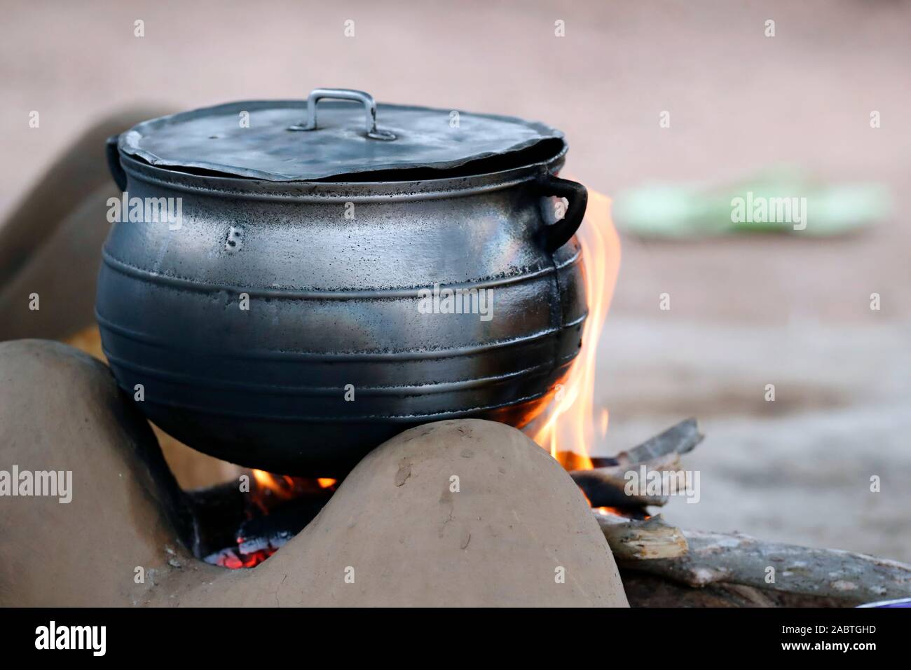African kitchen in a village. Cooking pot on fire. Datcha-Attikpaye ...