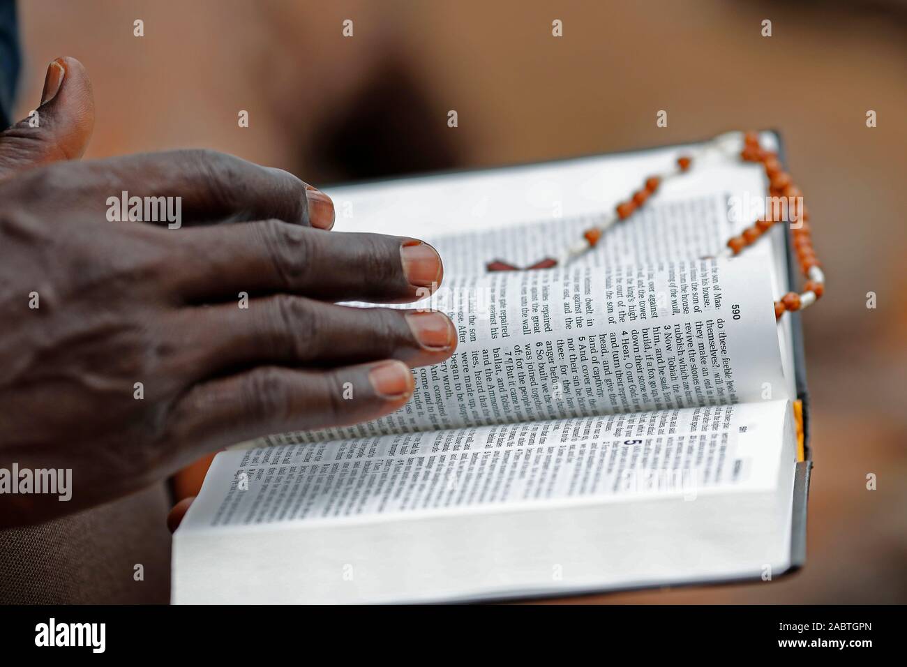 Bible study. African man reading the holy bible. Lome. Togo Stock Photo ...