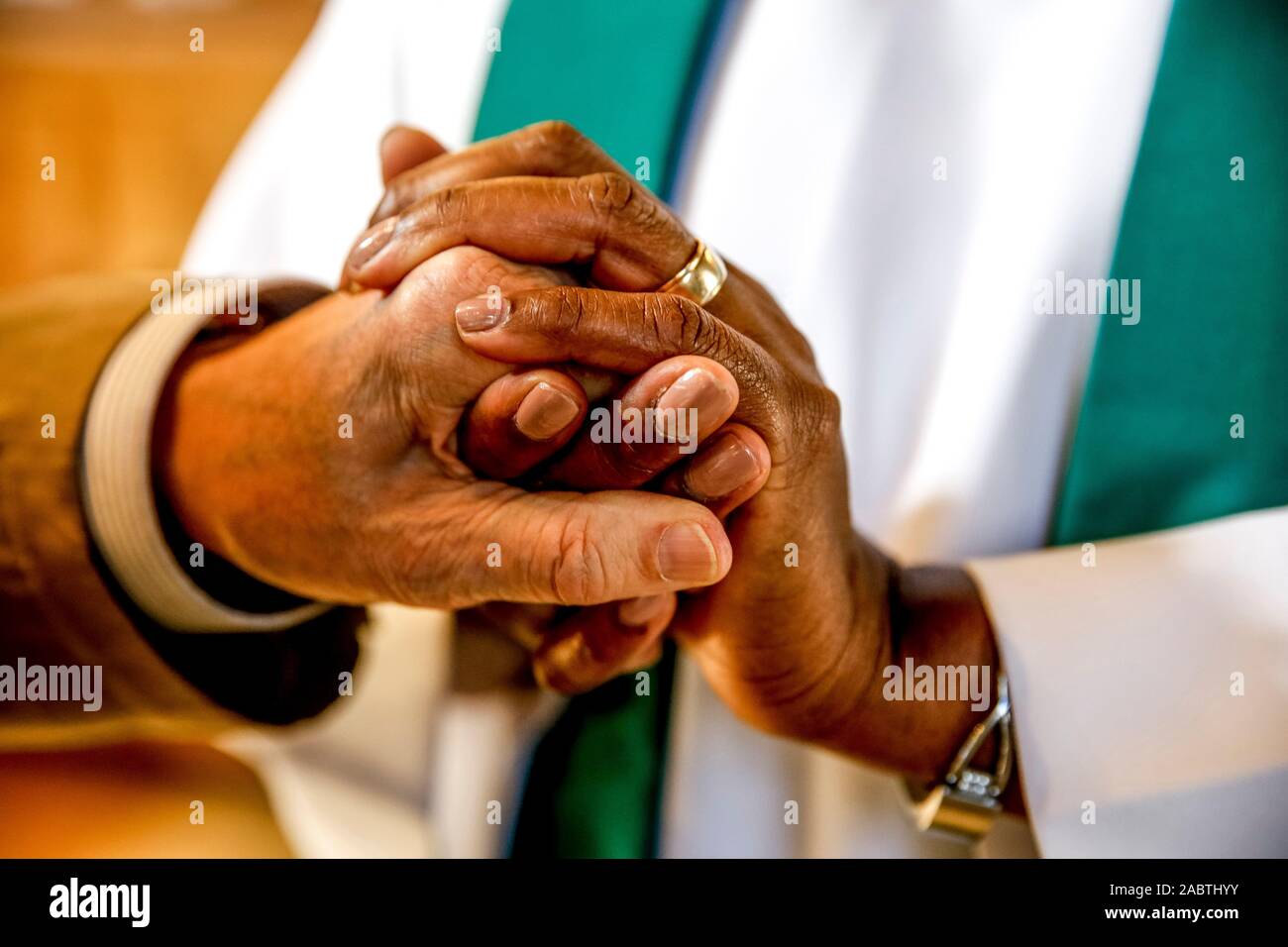 Anglican priestess Rose Hudson-Wilkin greeting parishioners in All ...