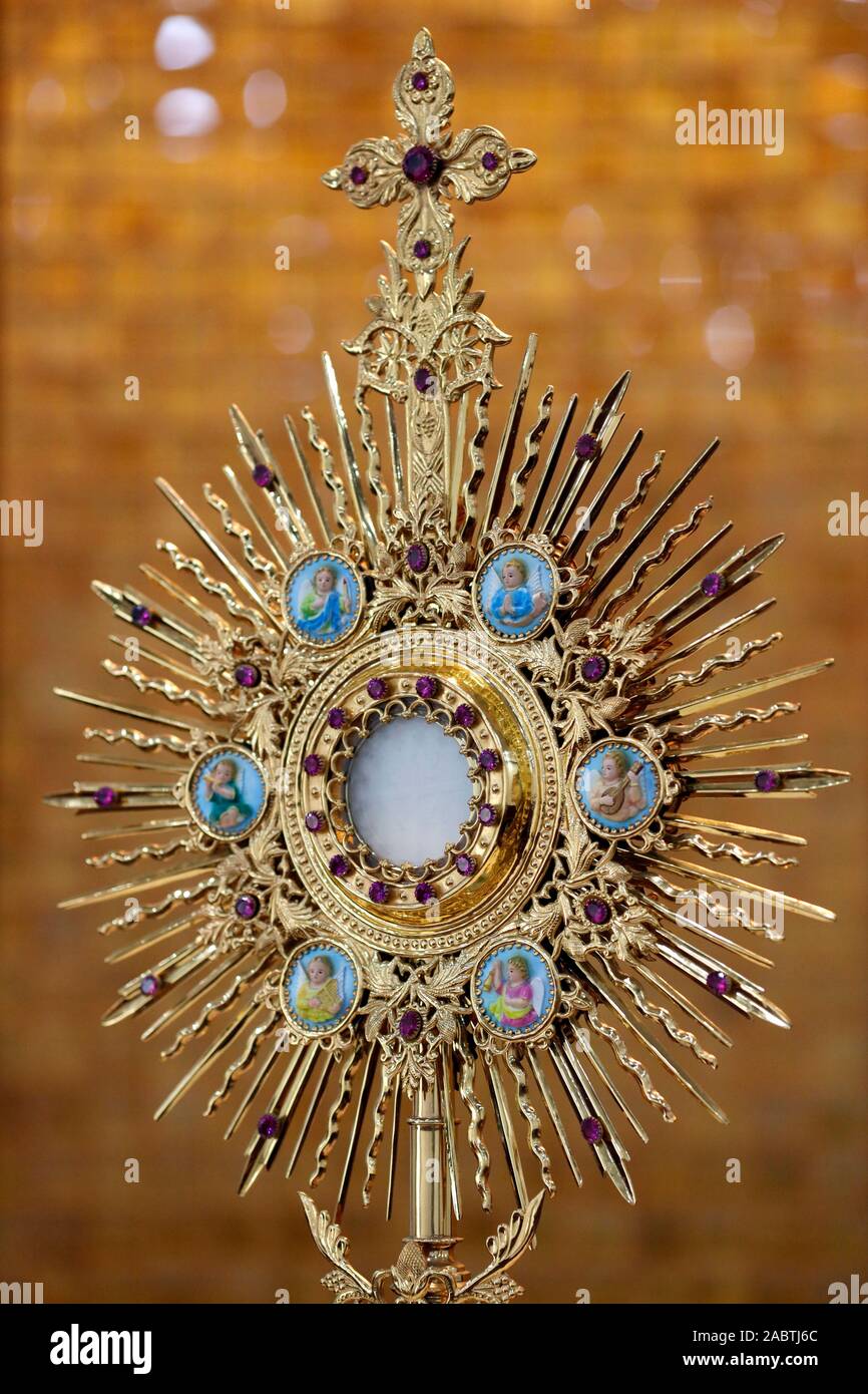 The Blessed Sacrament in a monstrance. Eucharist adoration Stock Photo ...