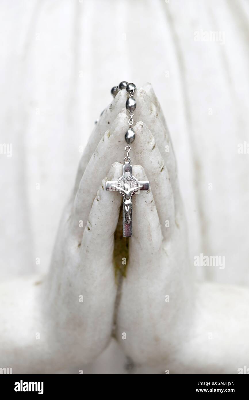 Angel statue. Rosary in hands. Close-up. Basilica of Our Lady of La ...