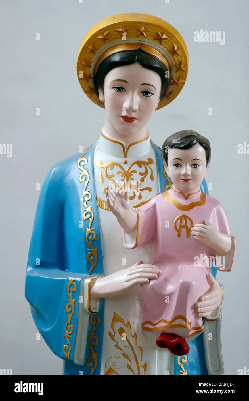 Statue of Our Lady of La Vang in Ao Dai dress. Phu Cam Cathedral. Hue ...