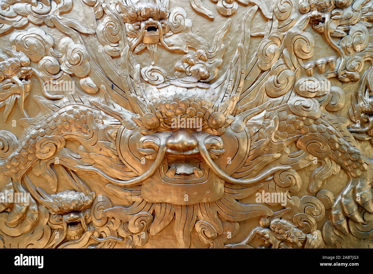 Chinese Relief Sculpture. Golden dragon. The dragon is a symbol of ...