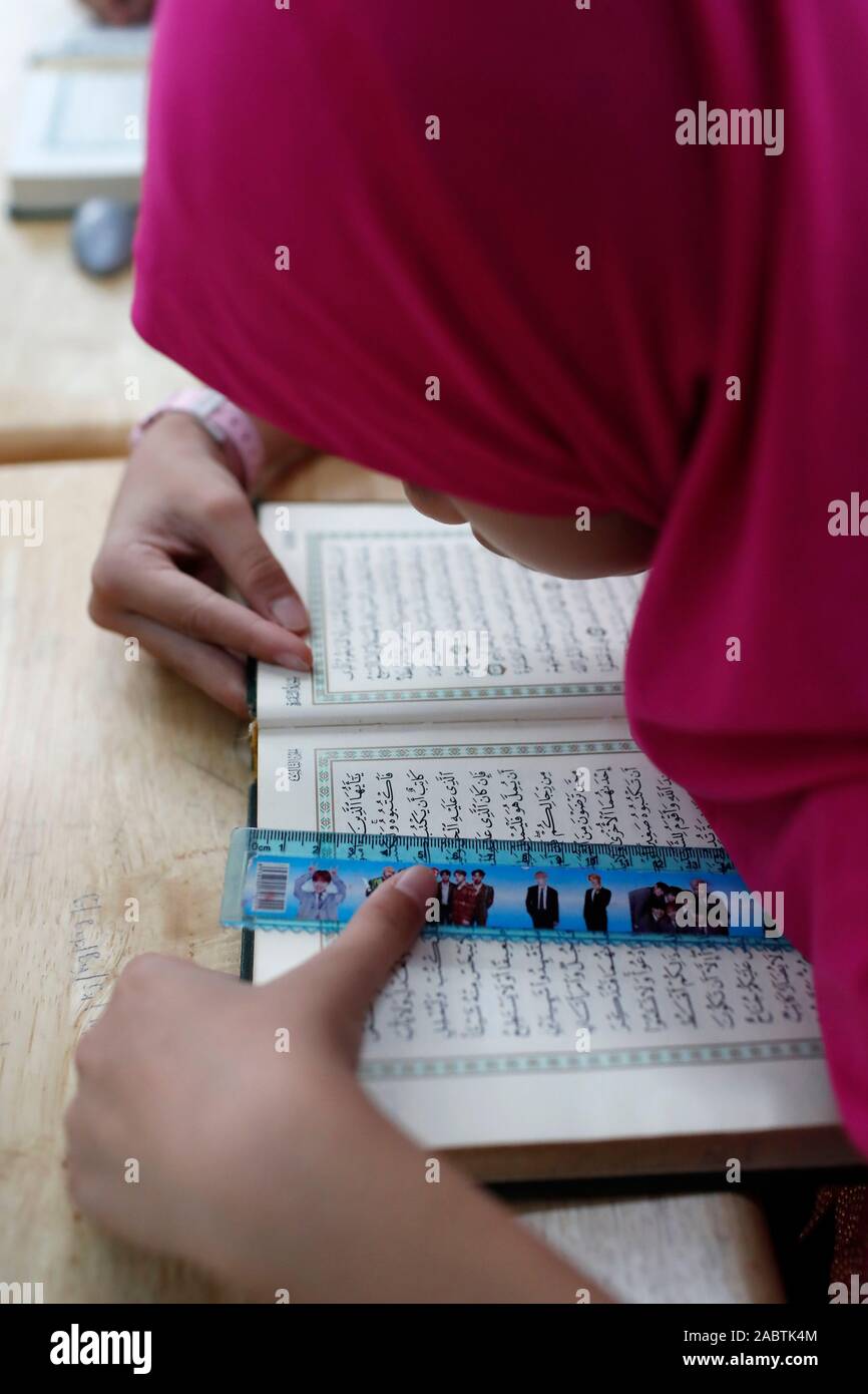 Muslim girl learning Quran at Islamic school Stock Photo - Alamy