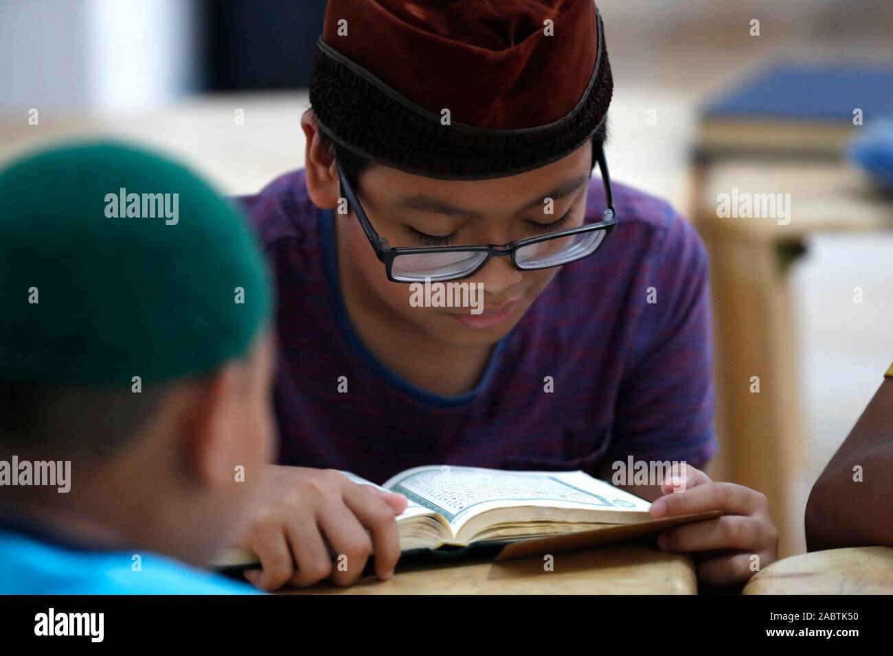 Learning quran hi-res stock photography and images - Alamy