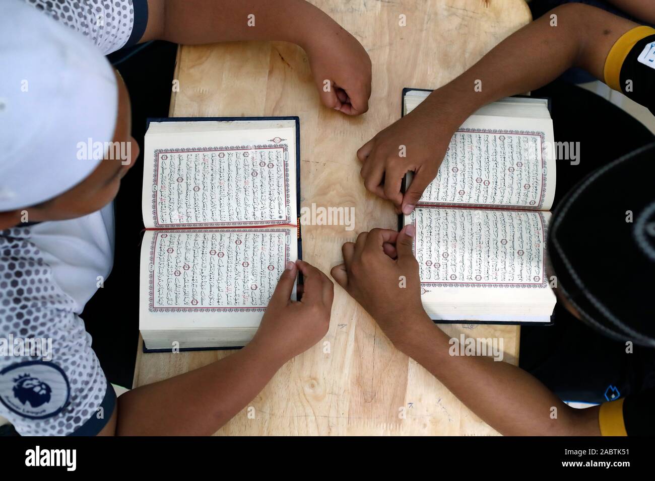 Muslim children learning Quran at Islamic school Stock Photo - Alamy